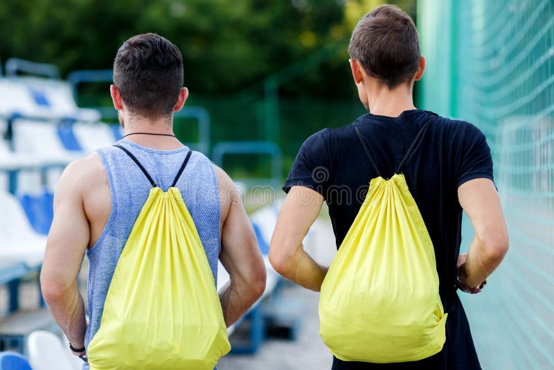 Fit Men Going To Training on Nature with Backpacks Stock Image - Image ...