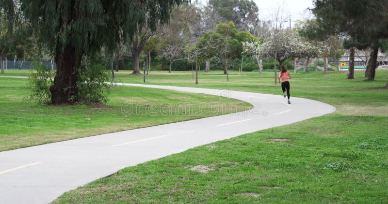 Fit Mixed Race Woman Running Along Path Stock Video - Video of blitz ...