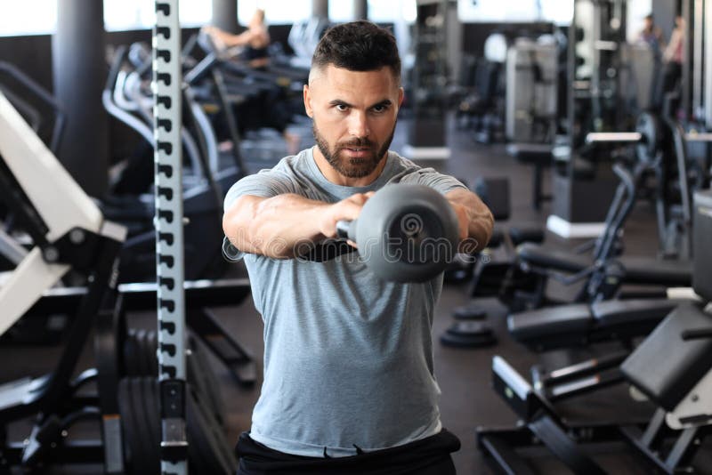 Fit and Muscular Indian Man Focused on Lifting a Dumbbell during an ...