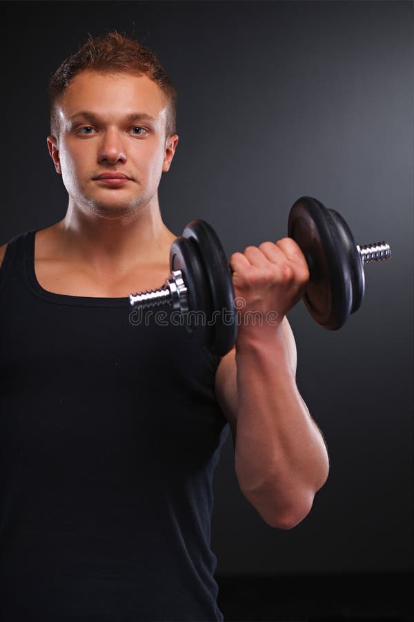 Fit Muscular Man Exercising with Dumbbell Stock Photo - Image of ...