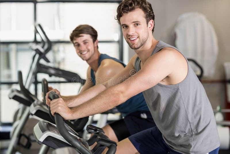 Fit People Doing Exercise Bike Stock Image - Image of shape, male: 66969549
