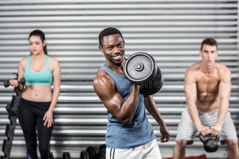 Fit People Lifting Dumbbells Stock Photo - Image of exercise, black ...