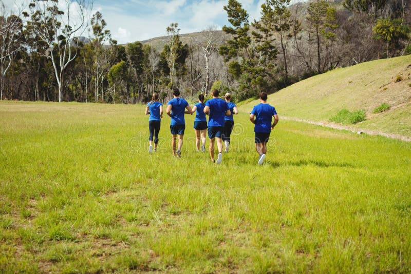 Fit People Running in Boot Camp Stock Photo - Image of healthy, female ...