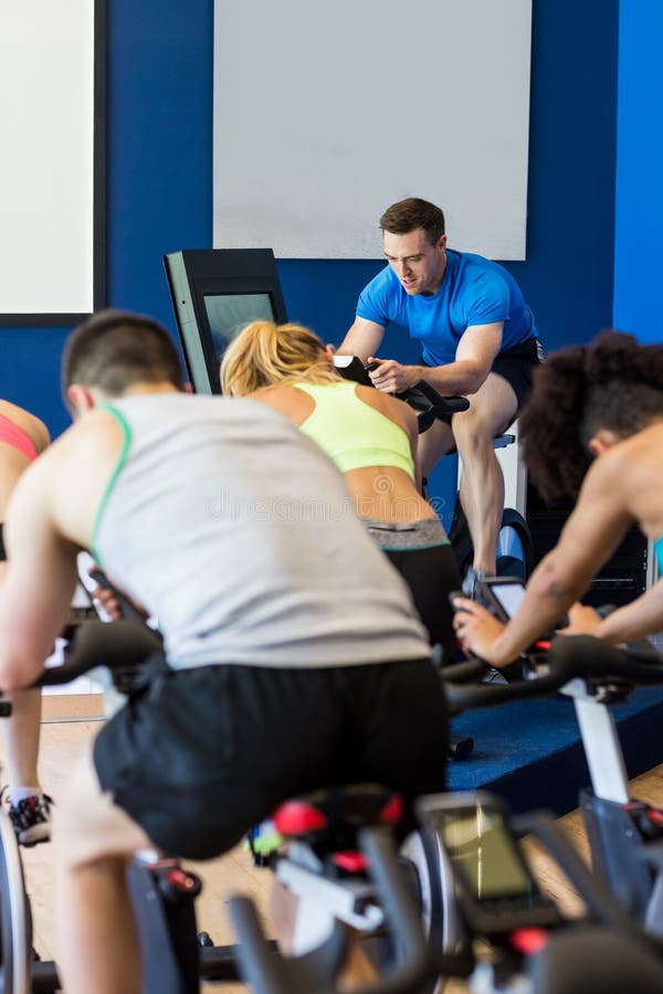 Fit people in a spin class stock image. Image of male - 60901119
