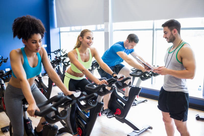 Fit people in a spin class stock photo. Image of shape - 60901848