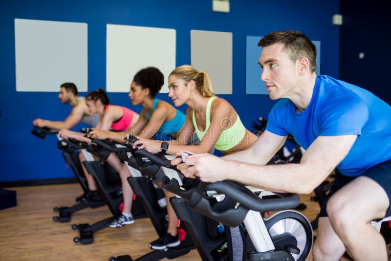 Fit people in a spin class stock image. Image of physical - 60908831