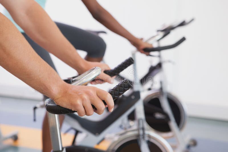 Fit People Working Out on the Exercise Bikes Stock Image - Image of ...