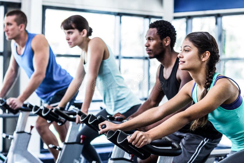 Fit People Working Out At Spinning Class Stock Photo - Image of active ...