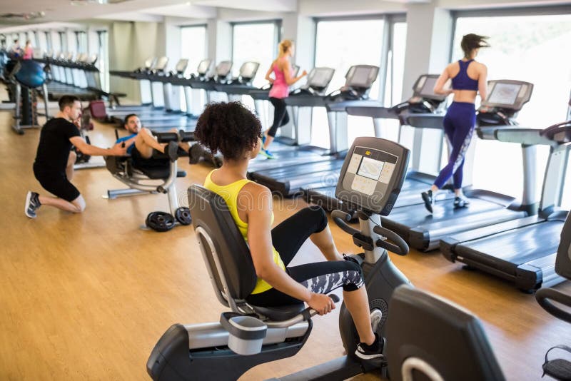 Fit People Working Out Using Machines Stock Photo - Image of healthy ...