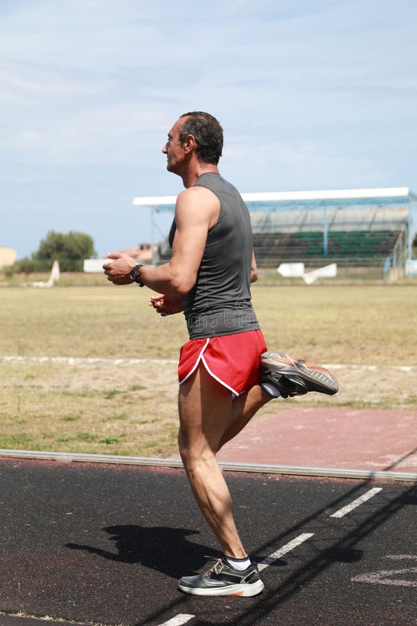 Fit Runner Sprinting on the Track Stock Photo - Image of competition ...