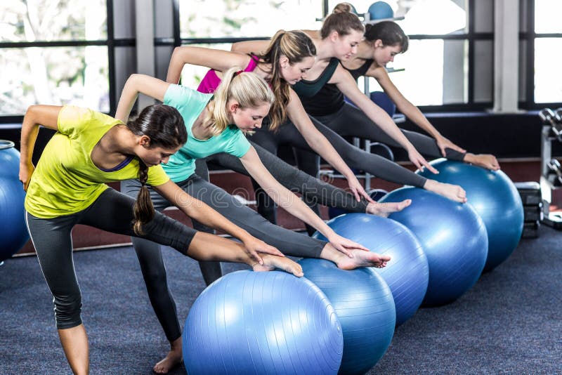 Fit Smiling Group Doing Exercise with Exercise Balls Stock Image ...