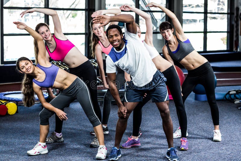 Fit Smiling Group Doing Exercise Stock Photo - Image of happy, girl ...