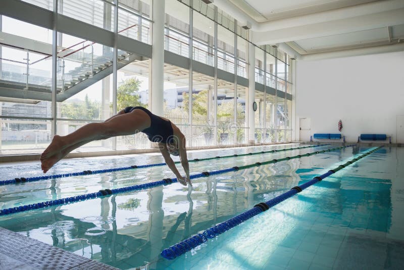 Swimmer Diving into the Pool at Leisure Center Stock Photo - Image of ...
