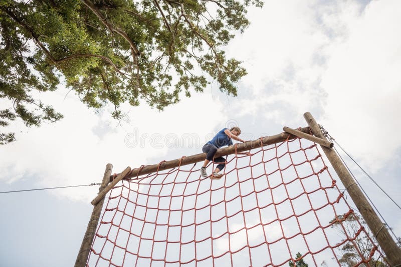 Fit Woman Climbing a Net during Obstacle Course Stock Photo - Image of ...