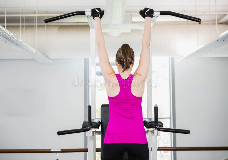 Fit woman doing pull up stock image. Image of active - 66431081