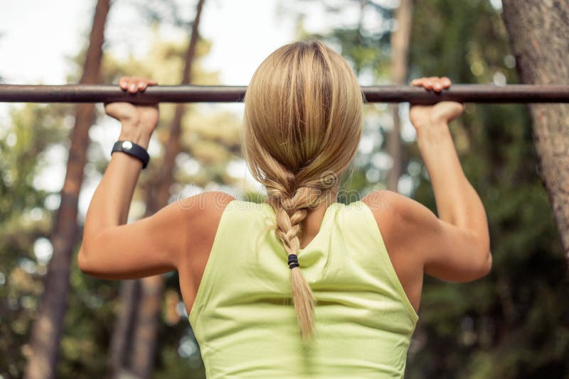 Man Doing Pull Ups while Working Out in Street Workout Park Stock Photo ...