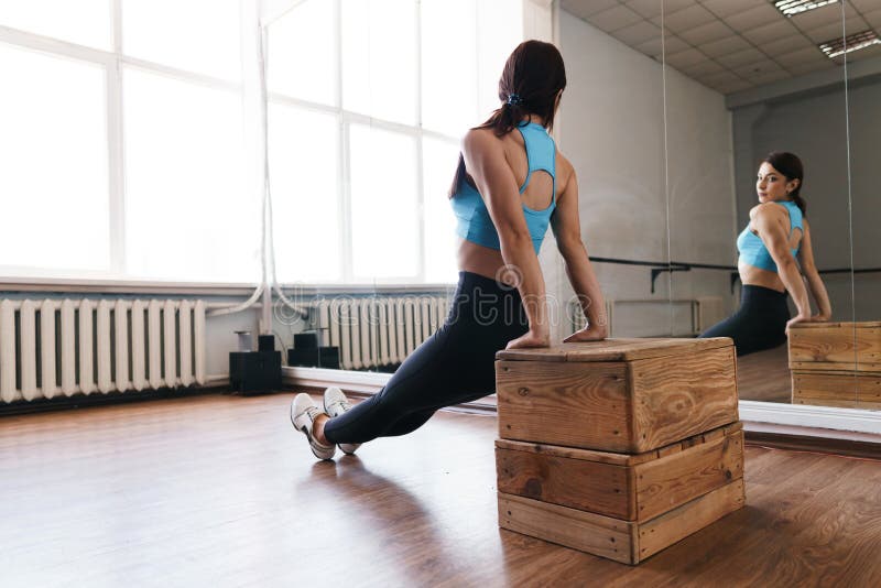 Fit Woman Doing Reverse Push Ups on Step Platform Stock Photo - Image ...
