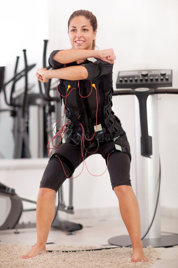 Fit Woman Exercise on Electro Muscular Machine Stock Photo - Image of ...