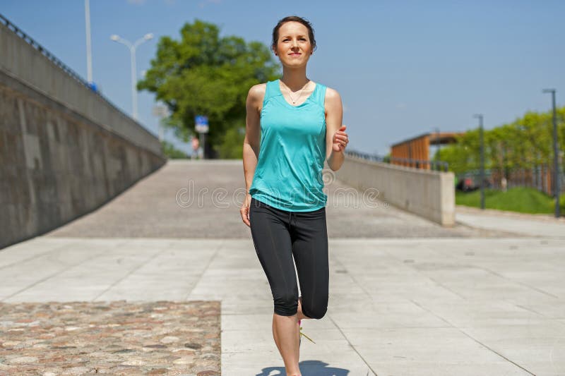 Fit woman jogging in park. stock image. Image of lifestyle - 72599949