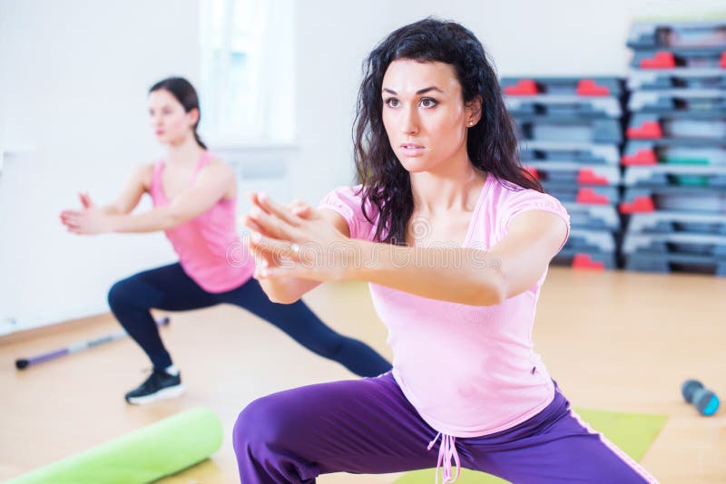 Fit Women Doing Side Lunges, Exercises for Legs, Hips and Buttocks ...