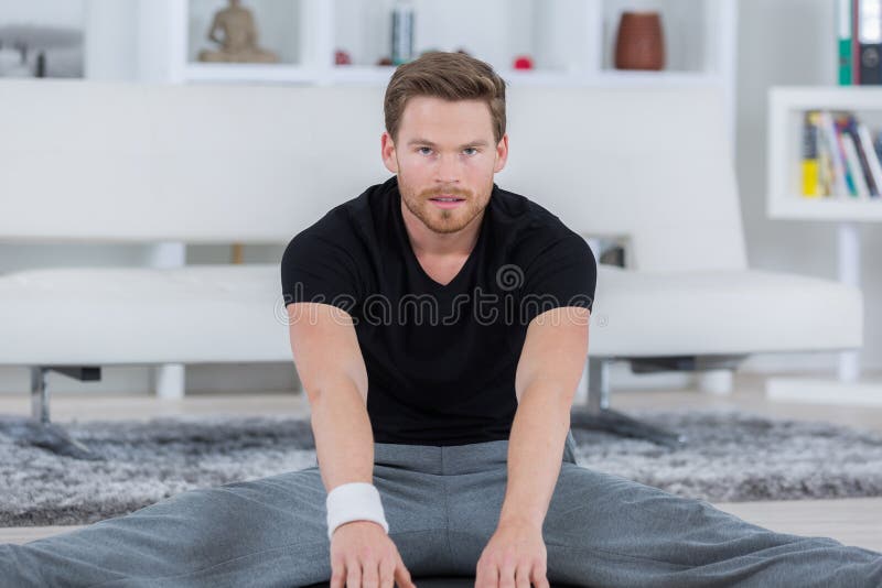 Fit Young Man Doing Stretching Exercise Stock Image - Image of handsome ...
