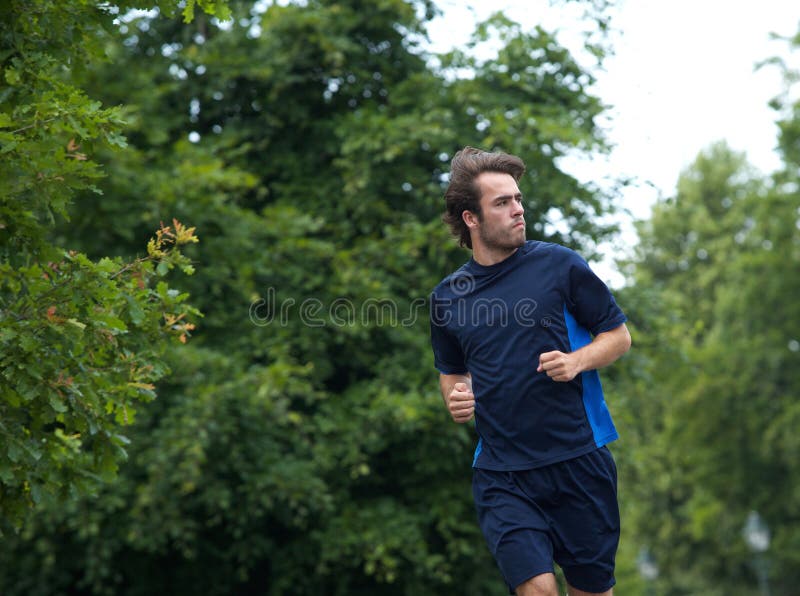 Fit Young Man Jogging Outdoors Stock Photo - Image of caucasian ...