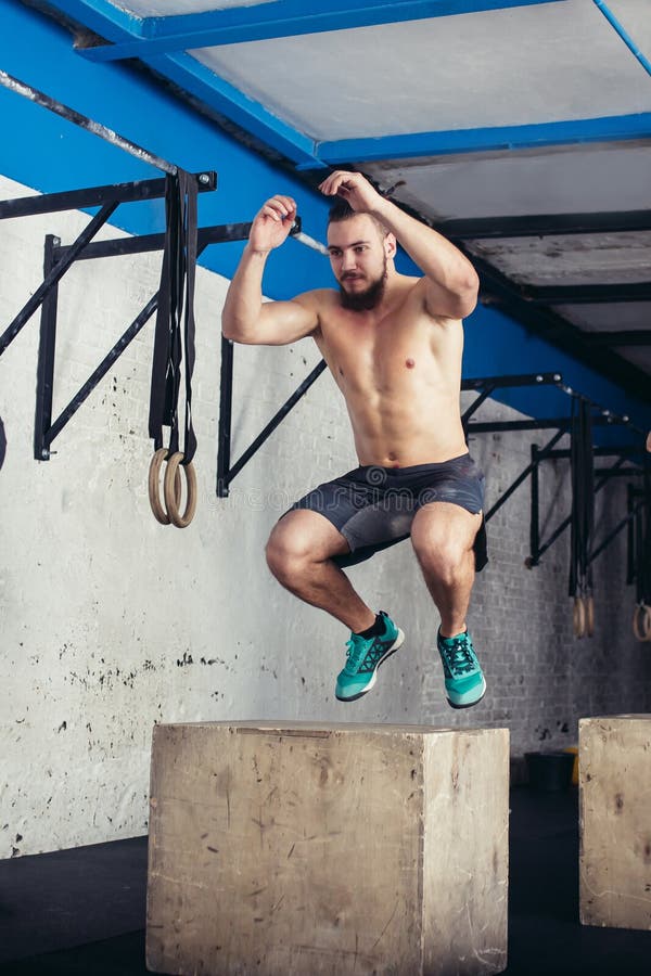 Fit Man Doing Box Jumps in a Gym Stock Photo - Image of circuit ...