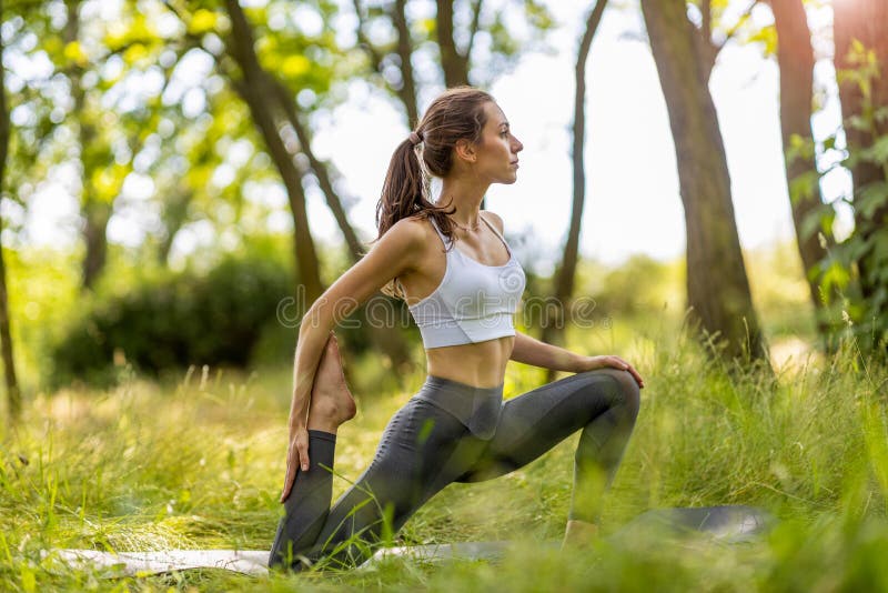 Fit Young Woman Exercising in Nature Stock Photo - Image of natural ...