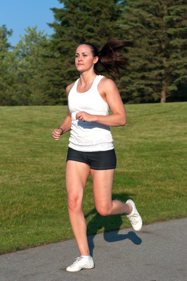 Fit young woman jogging stock photo. Image of recreation - 14813054