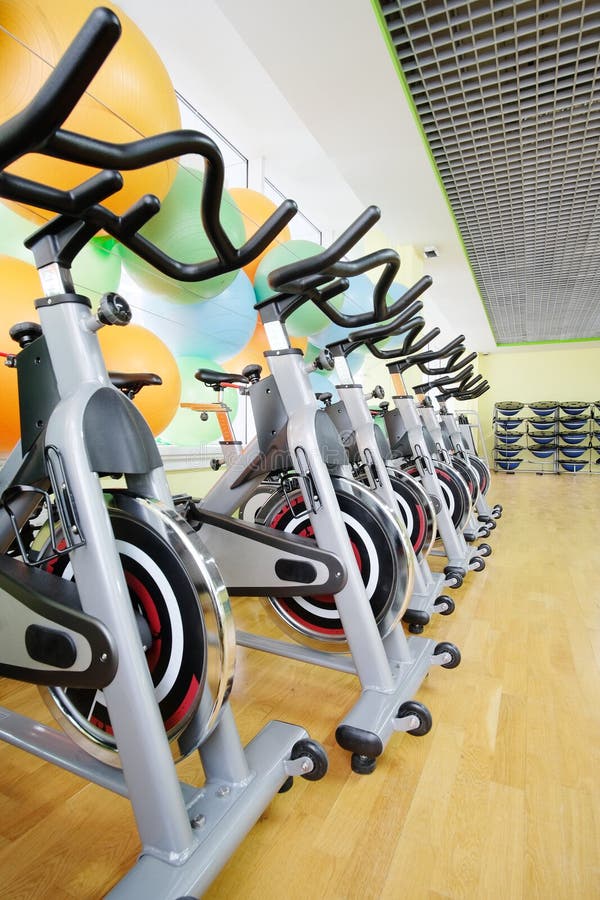 Fitness bikes stock photo. Image of ball, indoor, detail - 83342200