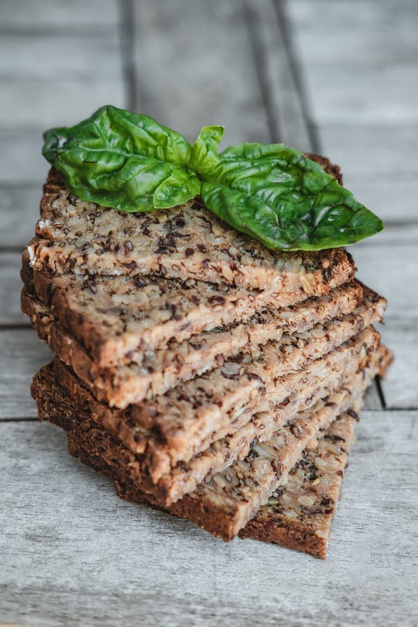 Fitness Bread with Basil Leaf on Rustic Wood Background, Closeu Stock ...