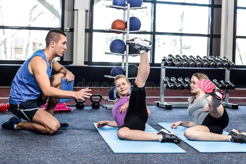 Fitness Class Doing Exercises on Mat Stock Image - Image of physical ...
