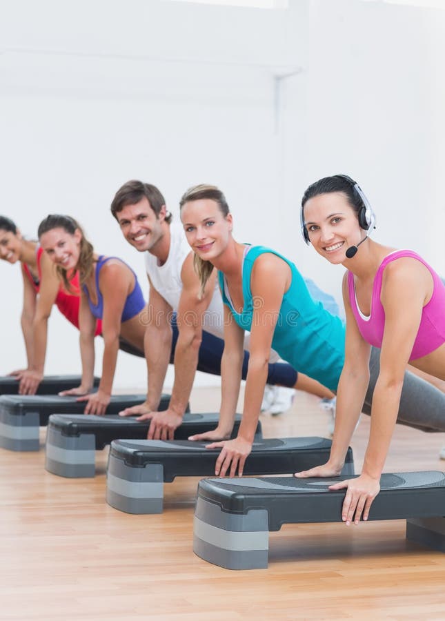 Fitness Class Doing Step Aerobics Exercise Stock Photo - Image of adult ...
