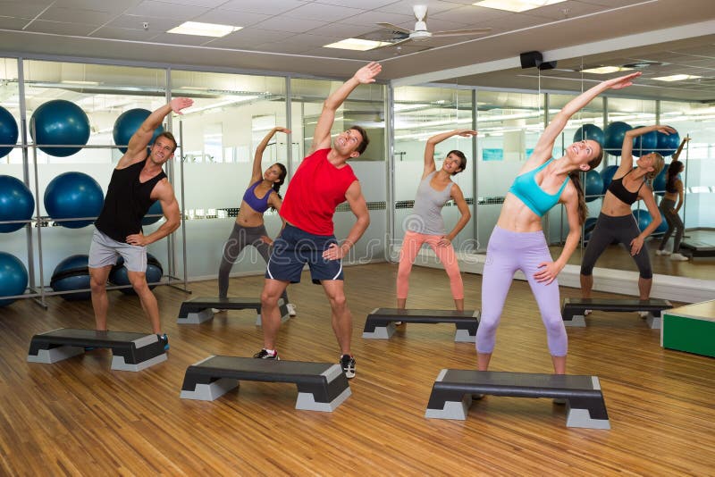 Fitness Class Doing Step Aerobics Stock Photo - Image of leisure ...