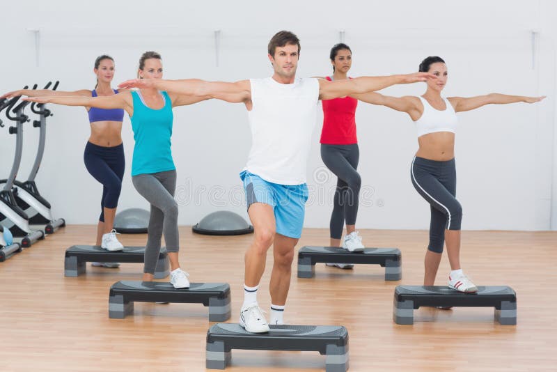 Fitness Class Performing Step Aerobics Exercise Stock Image - Image of ...