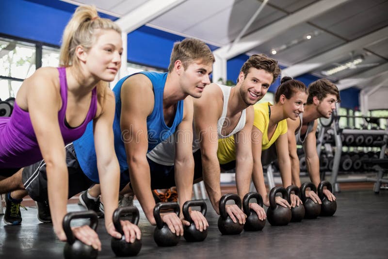 Fitness Class in Plank Position with Dumbbells Stock Photo - Image of ...