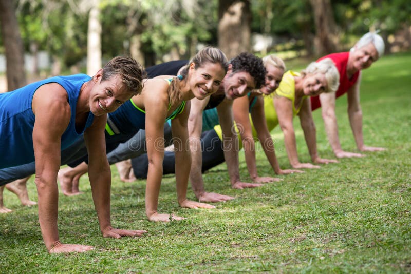 Fitness Class Practicing Yoga Stock Image - Image of parkland ...