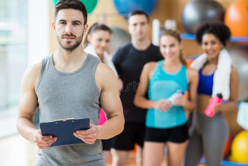 Fitness Class Smiling at Camera in Studio Stock Image - Image of bottle ...