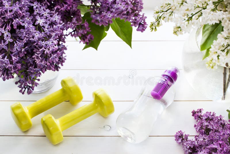 Fitness Concept with Dumbbells, Water Bottle and Flowers Stock Photo ...
