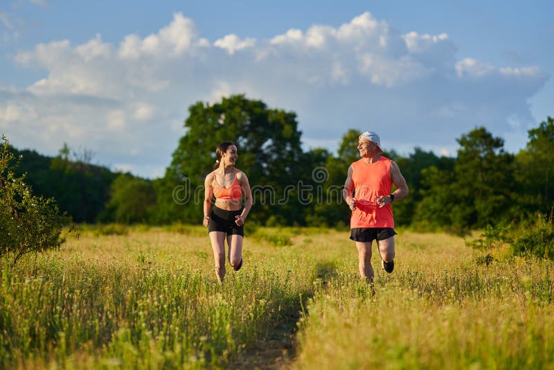 Fitness Couple Jogging in the Forest Stock Image - Image of sport, dirt ...