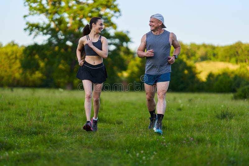 Fitness Couple Jogging in the Forest Stock Photo - Image of girl ...