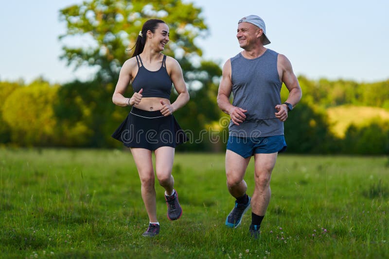 Fitness Couple Jogging in the Forest Stock Image - Image of runner ...