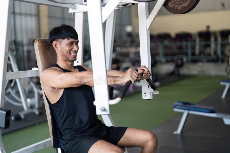 Young Man Engaging in Strength Training at Gym Stock Image - Image of ...