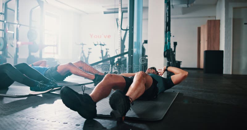 Fitness, Exercise or Sit Ups with Personal Trainer and Class in Gym for ...