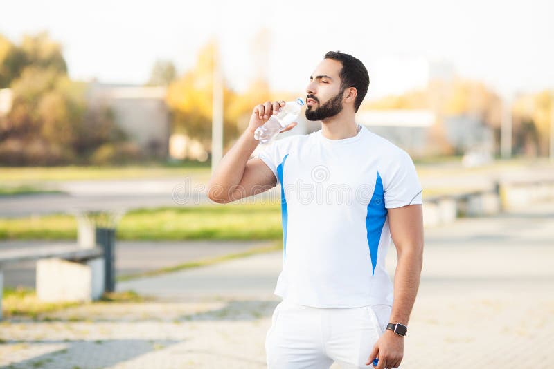 Fitness. Exhausted Runner Man Resting on the Park after Workout Stock ...