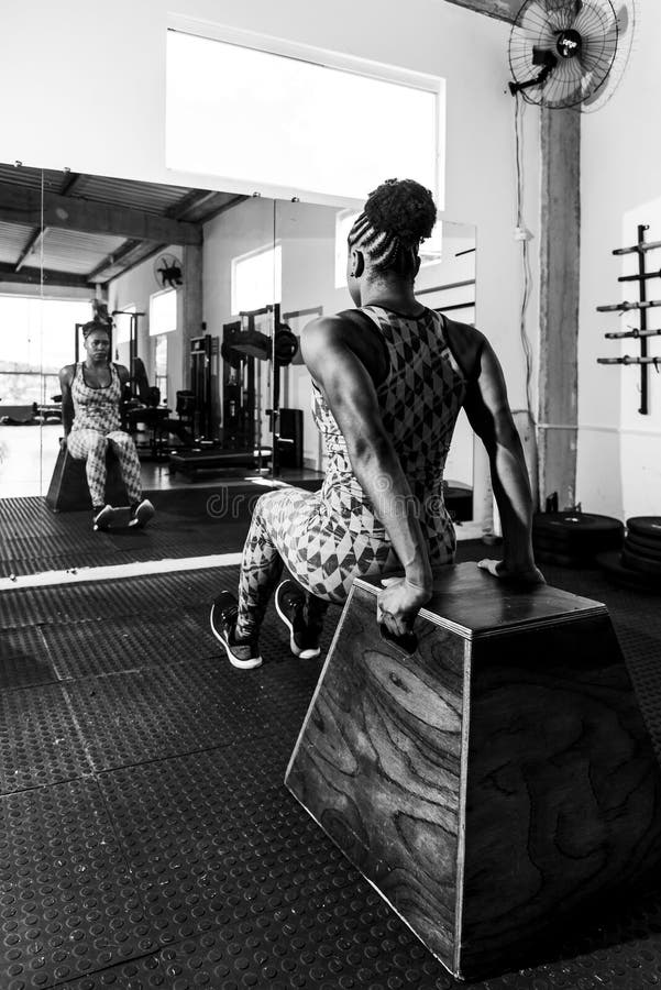 Fitness-focused Woman is Performing a Strength-training Exercise ...