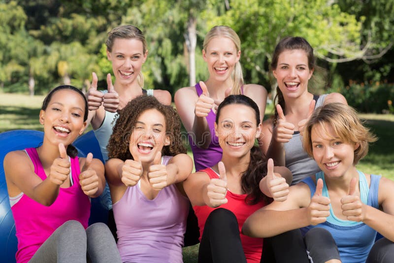 Fitness Group Smiling at Camera in Park Stock Photo - Image of ...