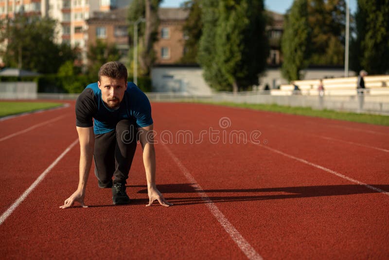 Fitness Guy Starting Run at the Stadium Stock Image - Image of posing ...