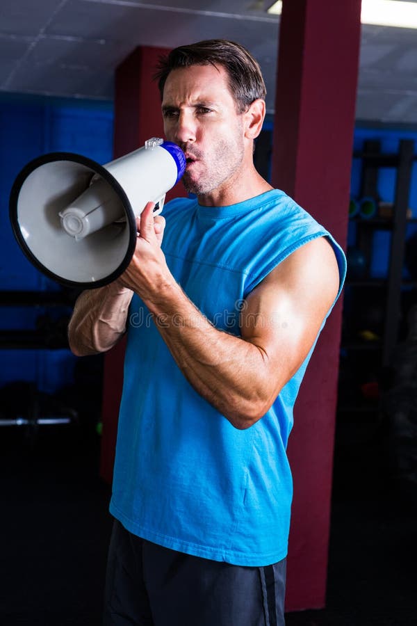 Fitness Instructor Shouting through Megaphone Stock Image - Image of ...