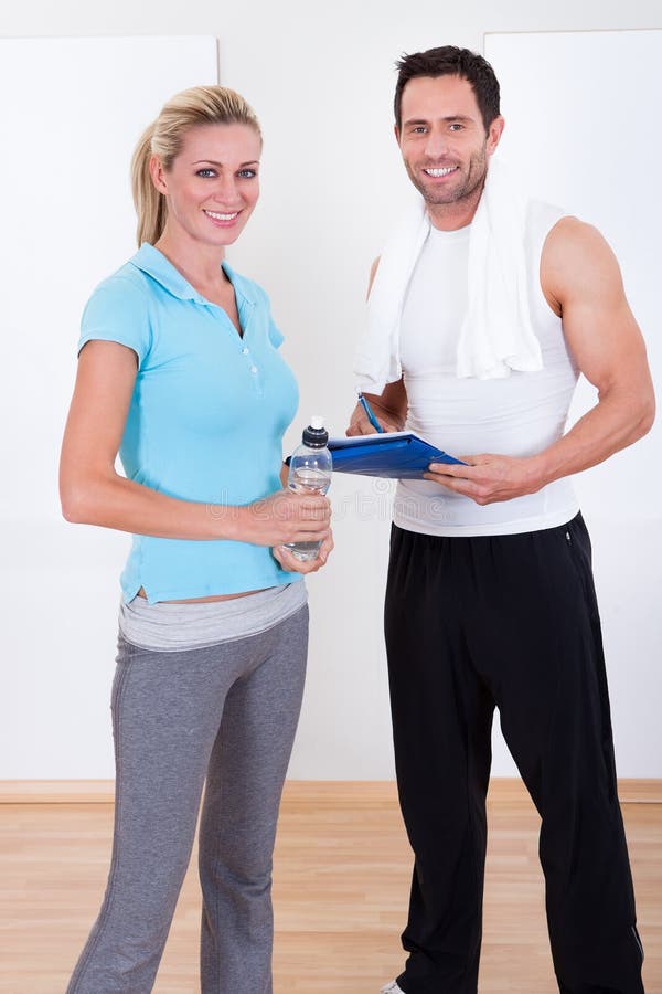 Fitness Instructor Taking Notes after a Session Stock Photo - Image of ...